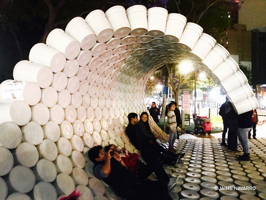 This Moveable Structure Made Out Of Buckets Carries A Vital Message